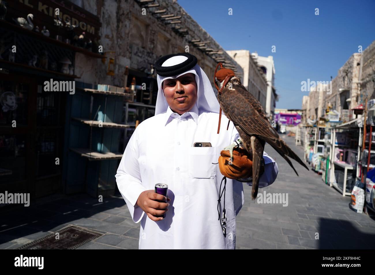 A resident carrying a bird, pictured in Souq Waqif, ahead of the FIFA ...