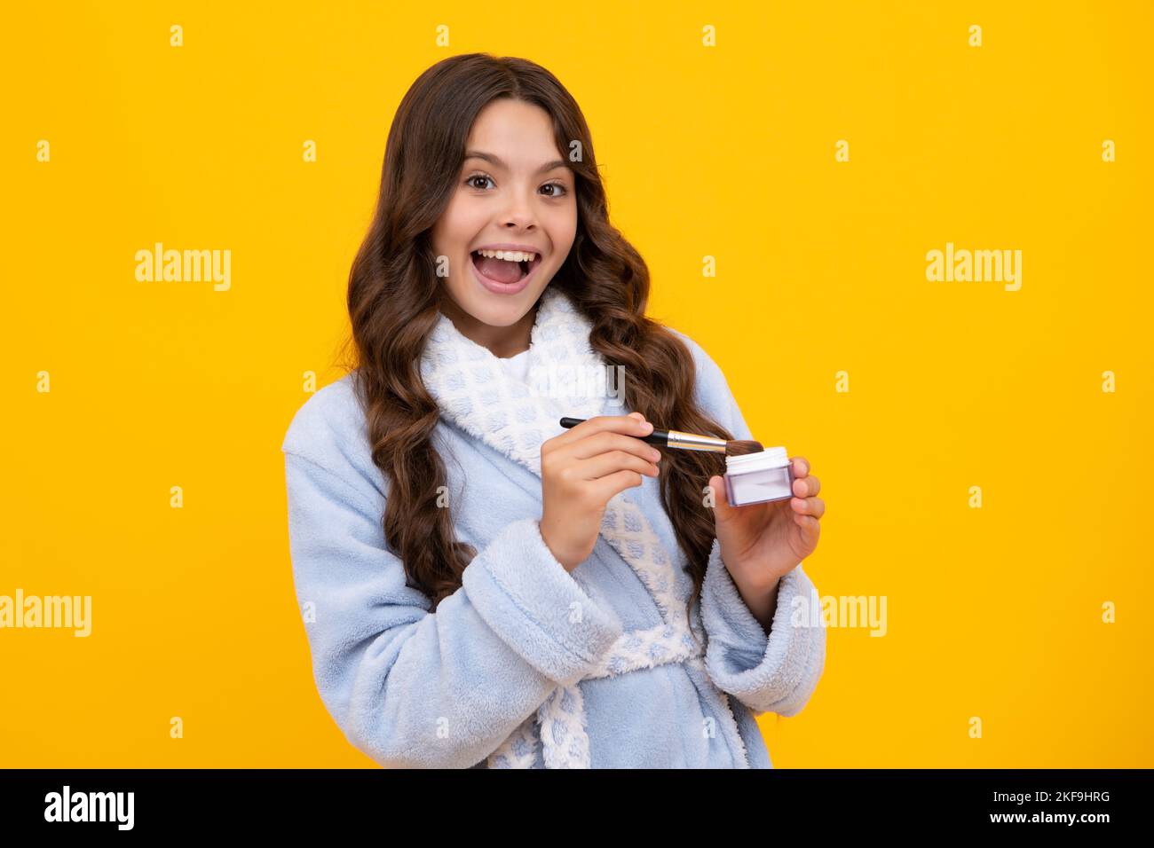 Beauty, make up and kids cosmetics. Teenage child girl with brush ...