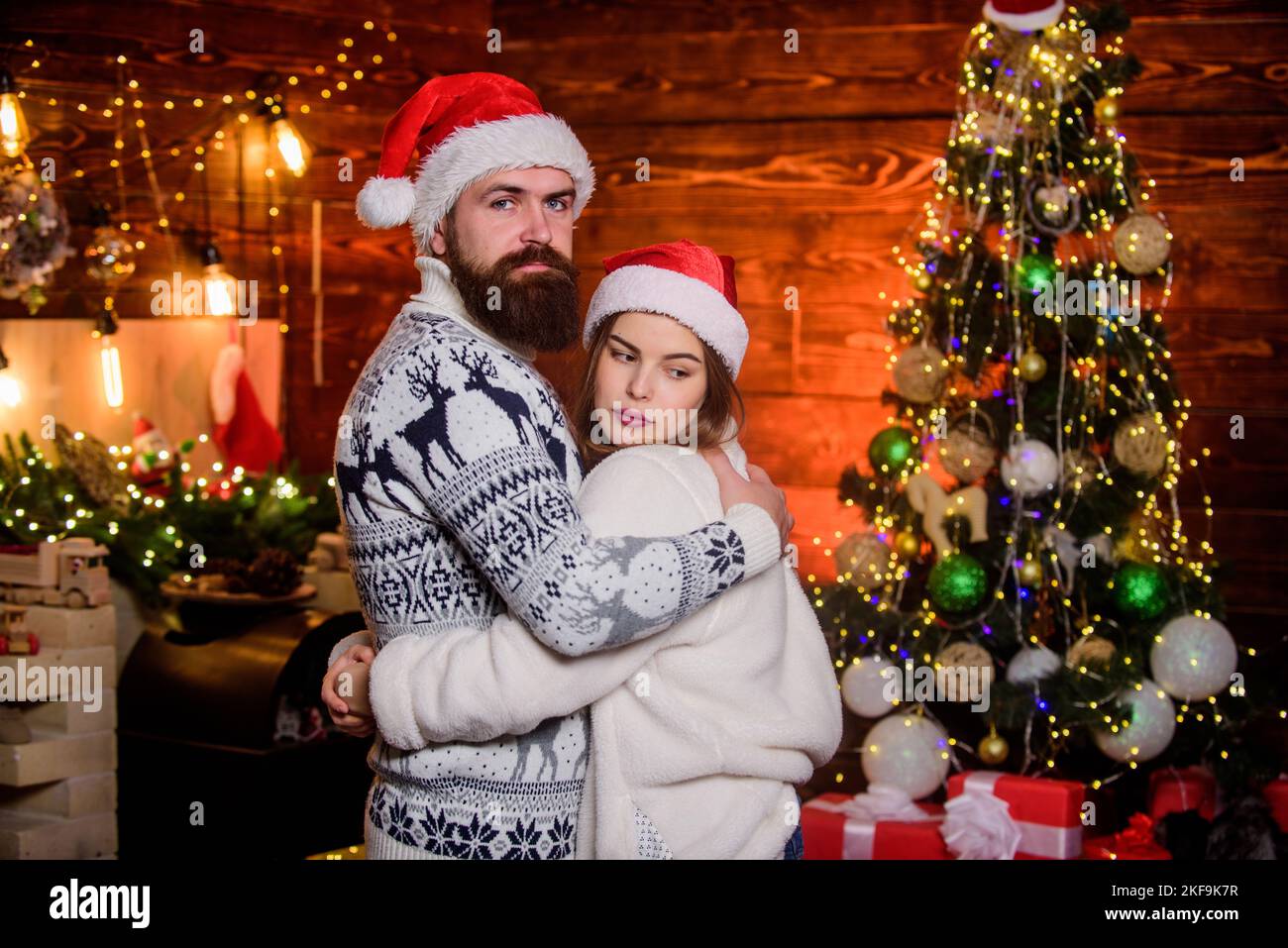 Couple in love enjoy christmas holiday celebration. Family tradition ...