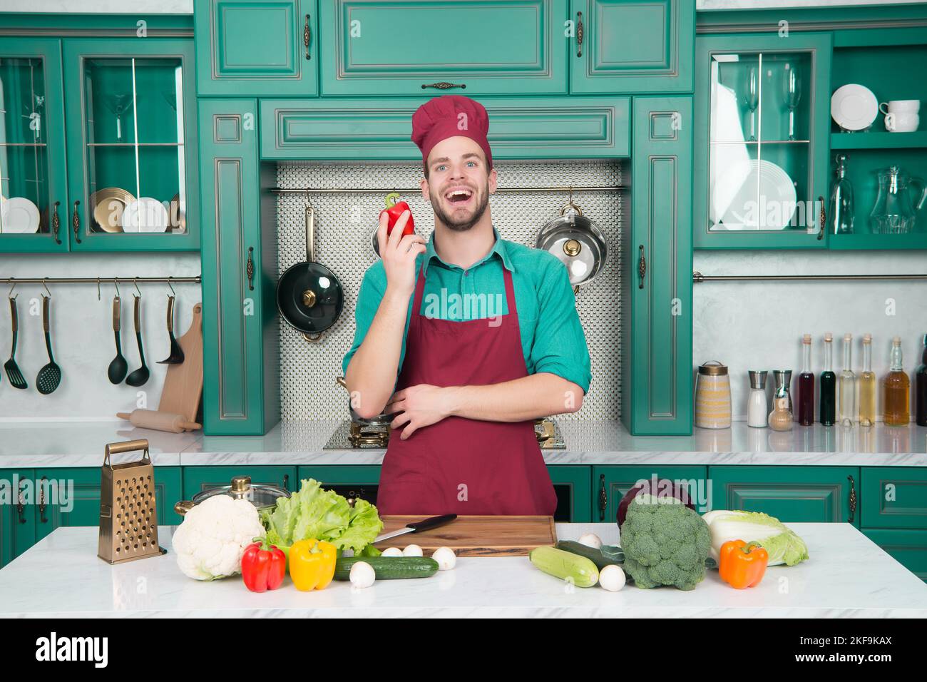 Young man preparing delicious and healthy food with vegetables Stock ...