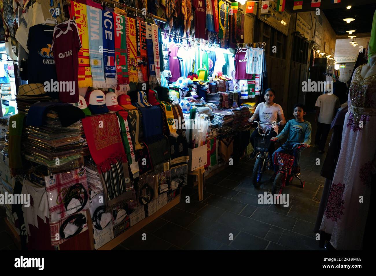 Football shirts and merchandise for sale at a store in Souq Waqif ...