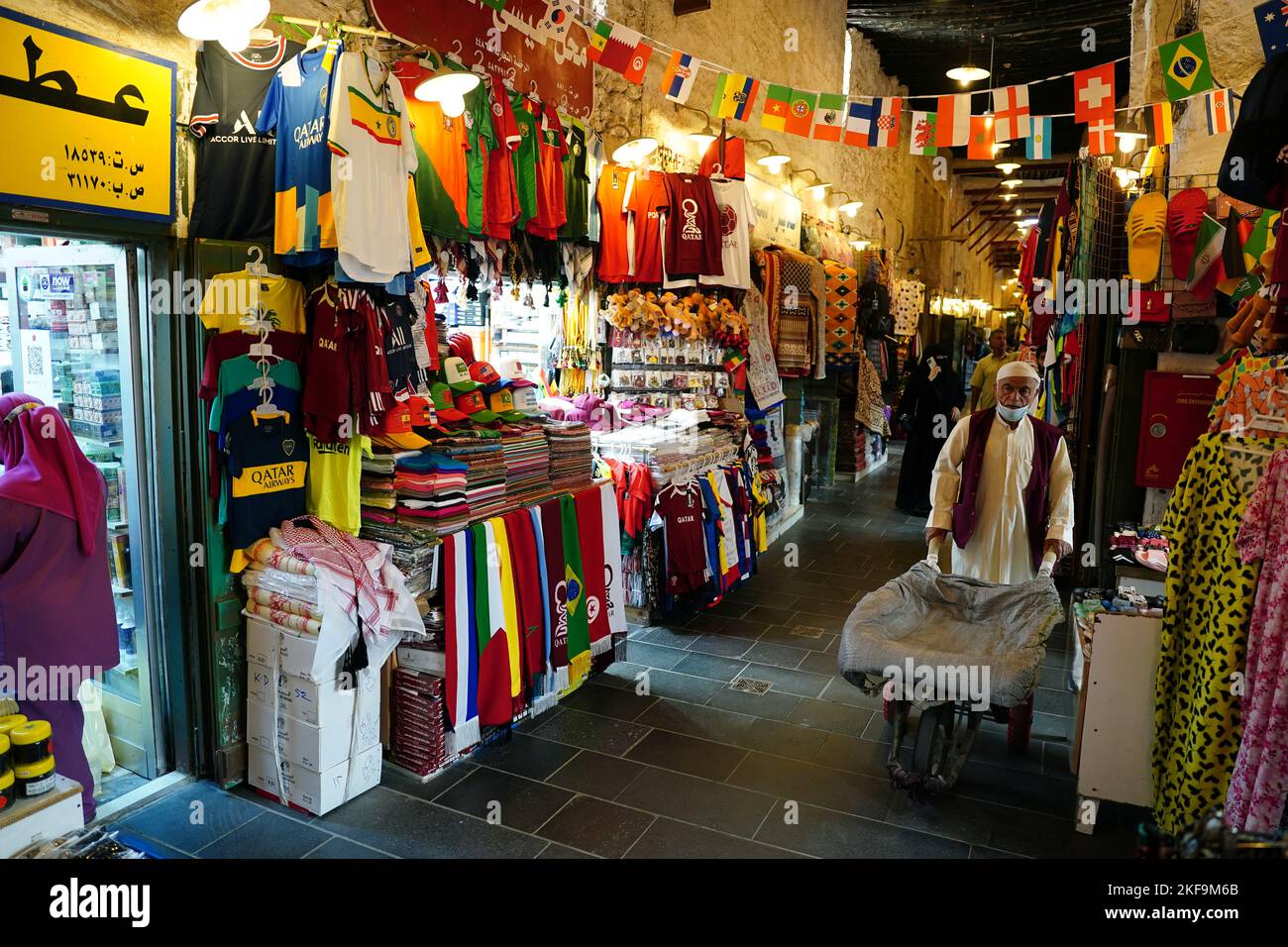 Football shirts and merchandise for sale at a store in Souq Waqif ...
