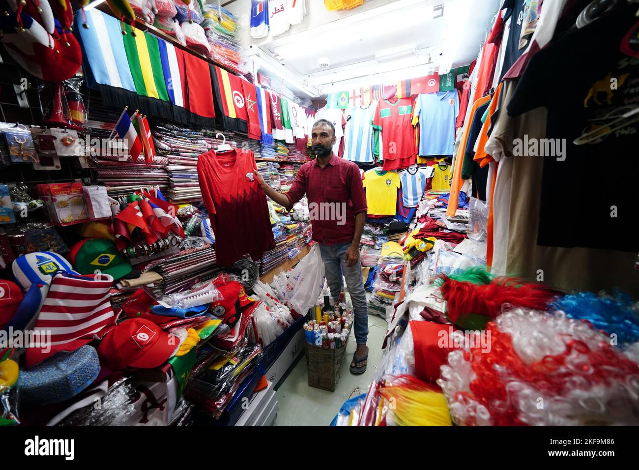 Football shirts and merchandise for sale at a store in Souq Waqif ...