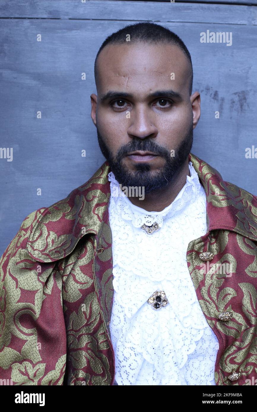 Ethnic man wearing baroque style outfit Stock Photo - Alamy