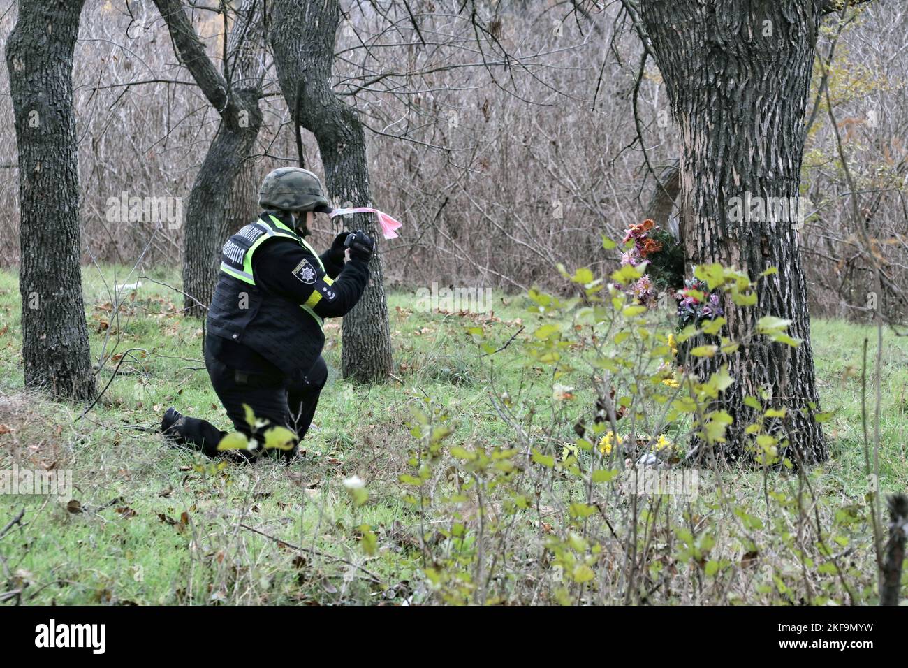 KHERSON, UKRAINE - NOVEMBER 16, 2022 - An investigator examines the ...