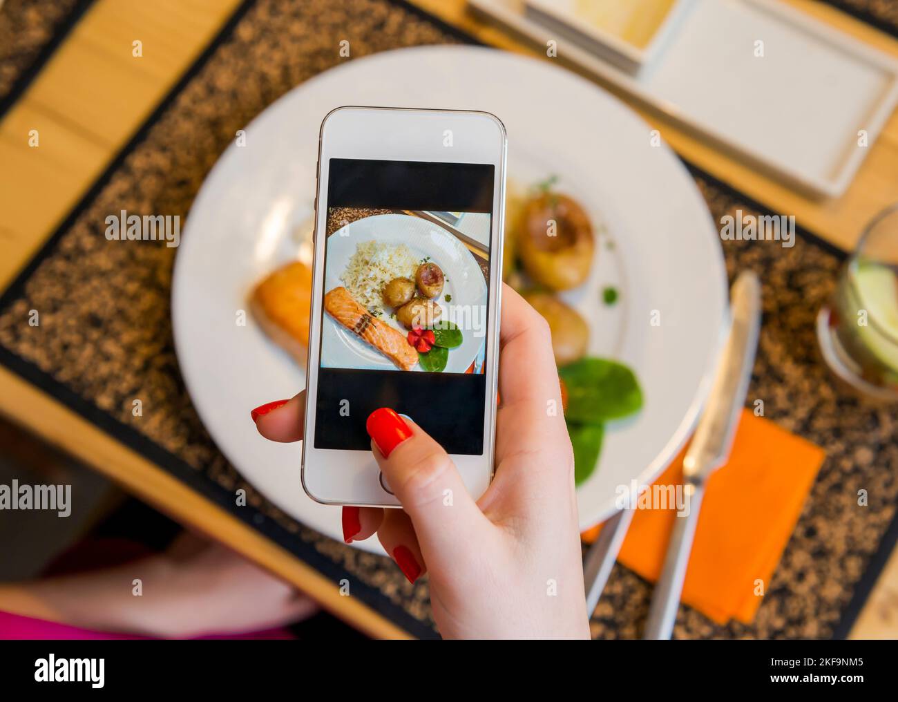 Taking a picture of the food at the restaurant Stock Photo - Alamy