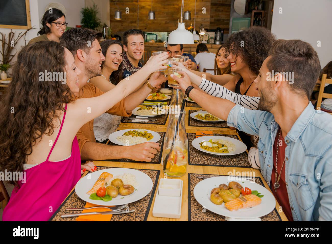 Group of friends toasting and havig fun at the restaurant Stock Photo ...