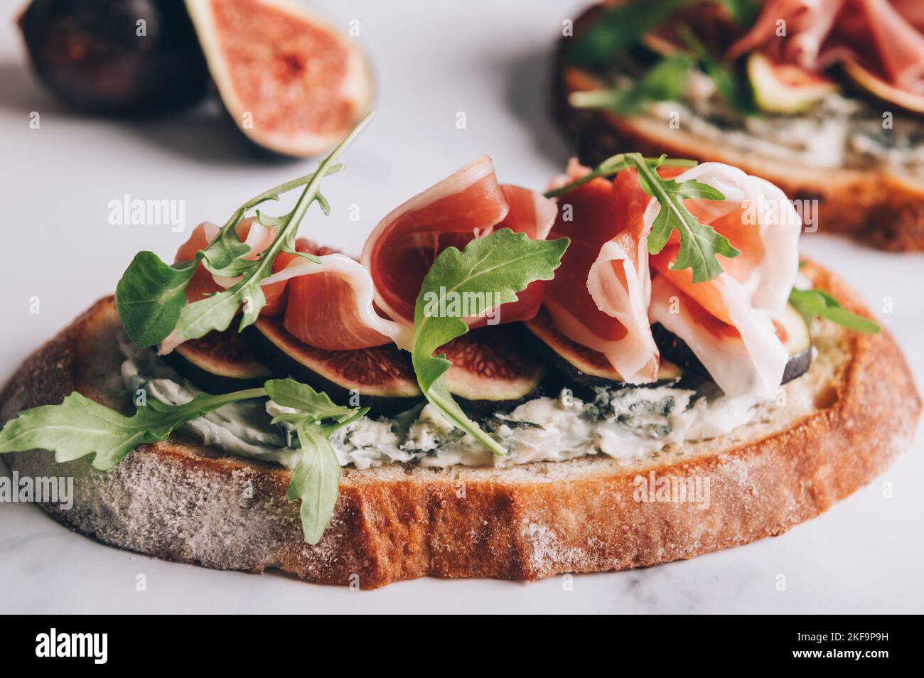 Open Sandwich with Prosciutto and Figs Stock Photo - Alamy