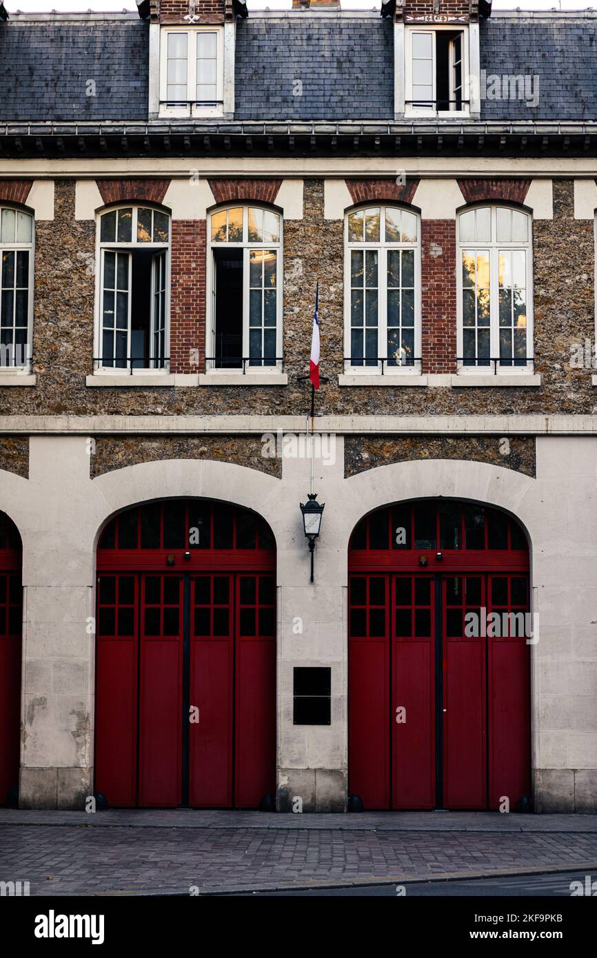 A vertical shot of a fire station with red gates Stock Photo - Alamy