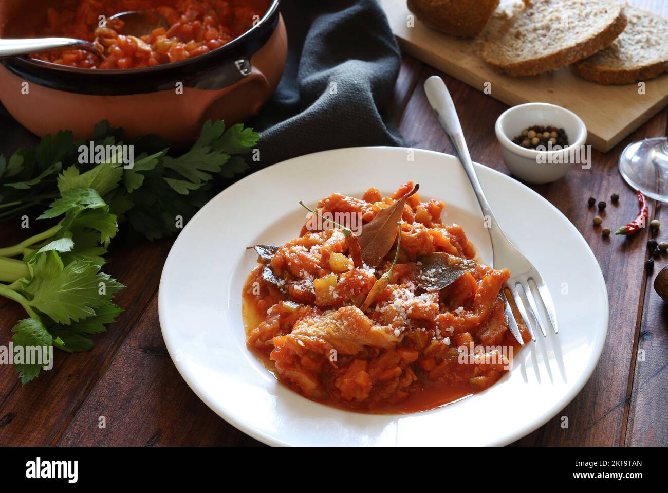 Italian food. Beef tripe with tomato sauce on rustic table. Directly ...
