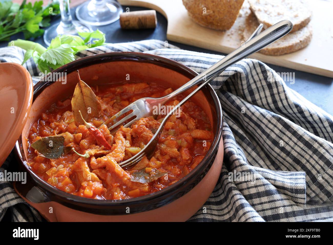 Italian food. Beef tripe with tomato sauce on rustic table. Directly ...