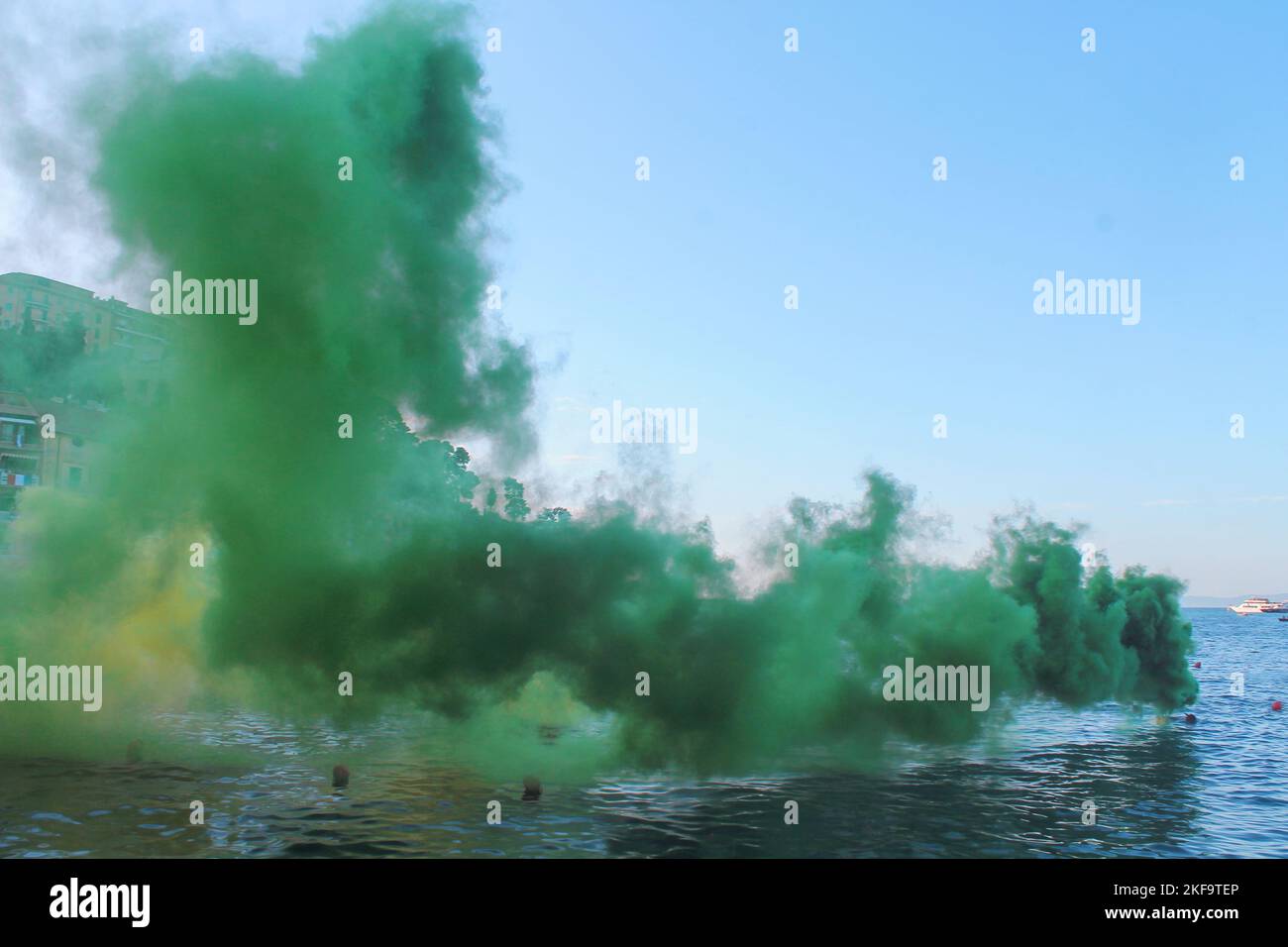 Colored smoke on water. Concept of celebration, creativity. Copy space ...