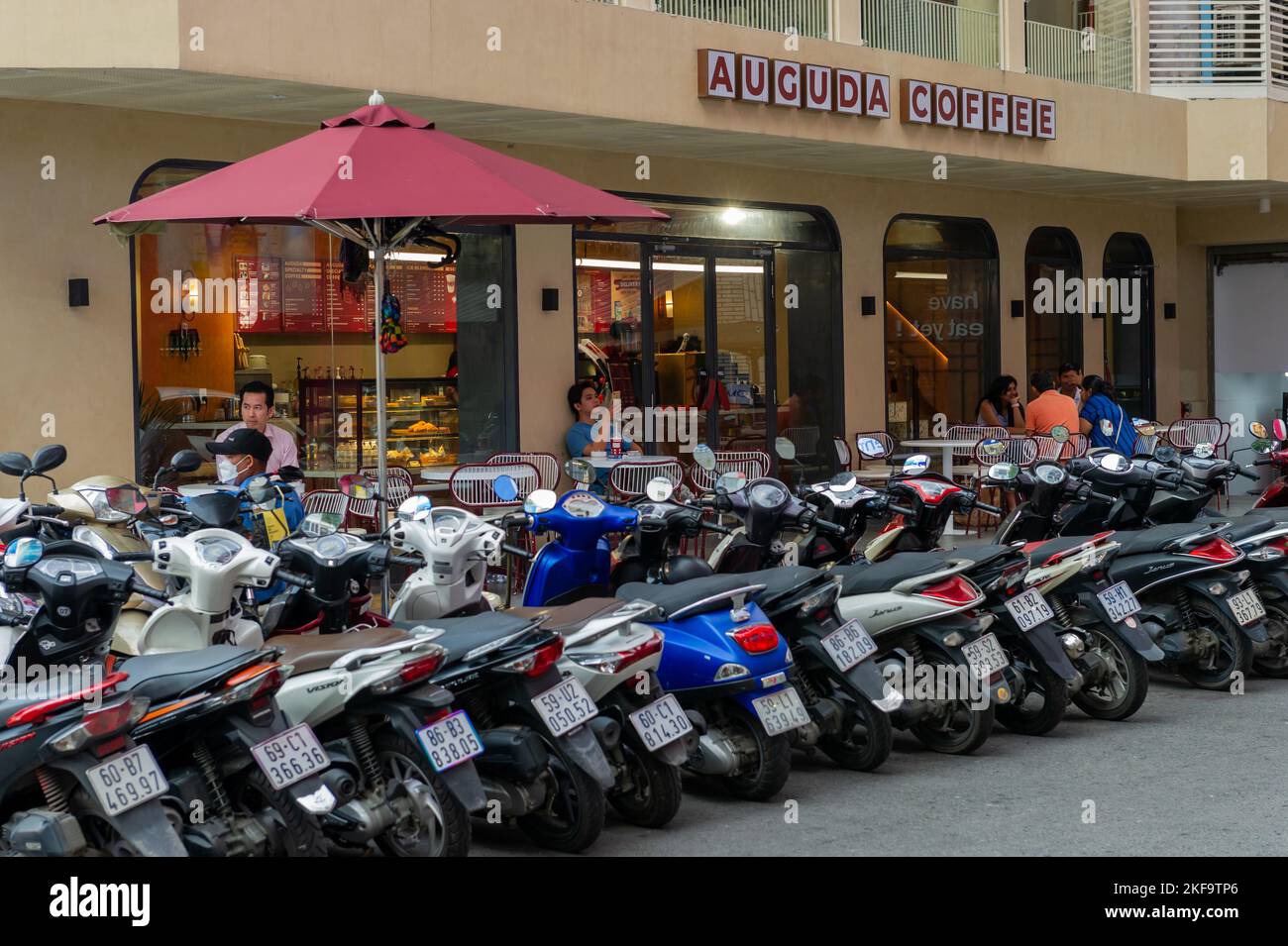 Motorcycles lined up outside a Vietnamese Coffee Shop in Ho Chi Minh ...