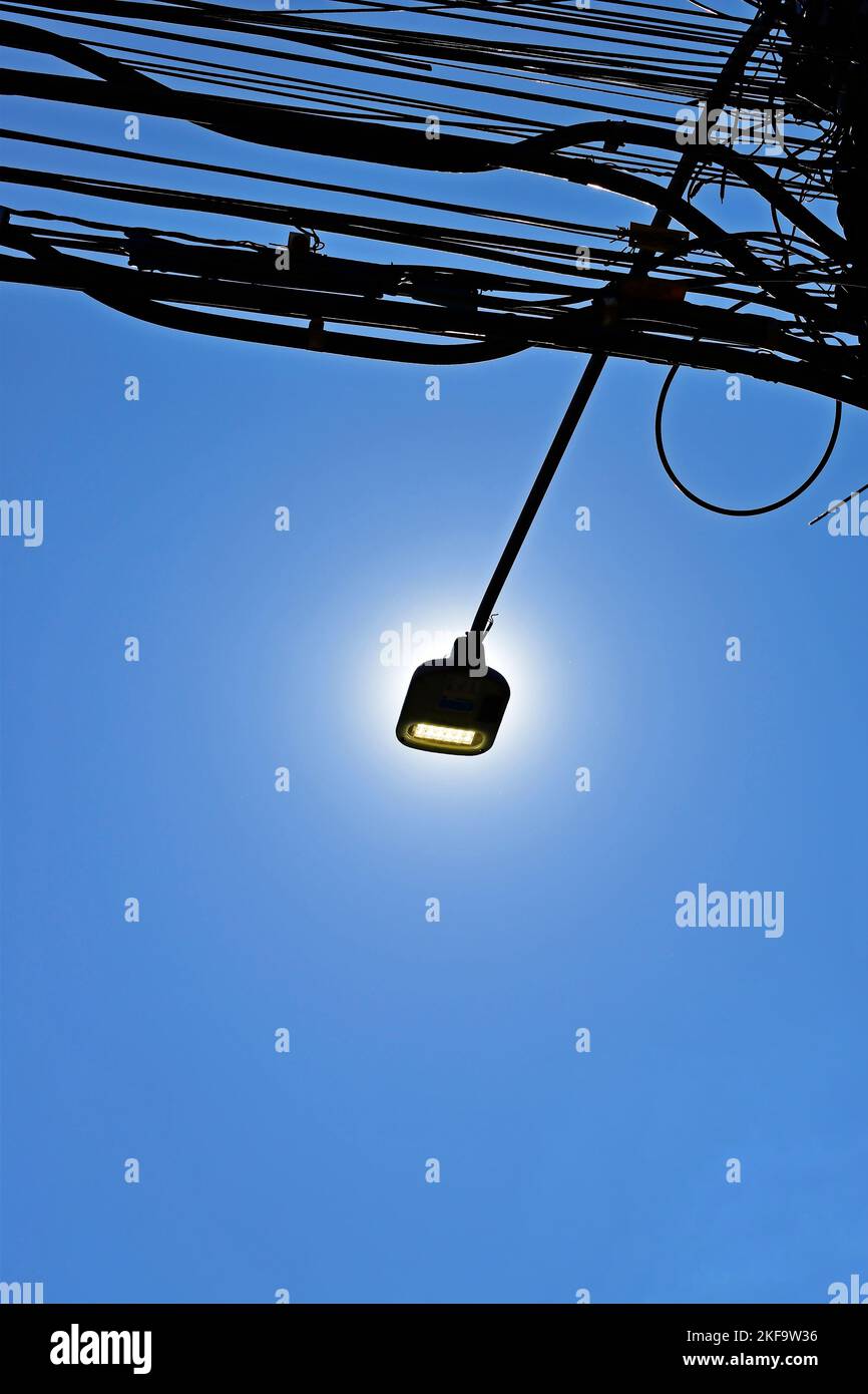 Electrical wires, light pole and sun light in Teresopolis, Rio de ...