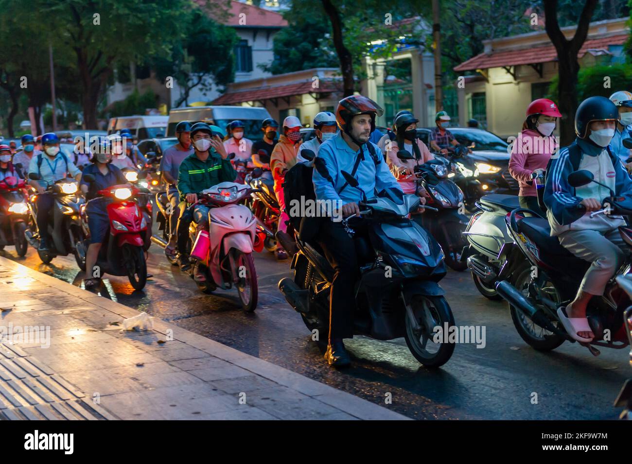 Saigon Street Life. A rush hour motorcycle swarm a dusk in Ho Chi Minh ...