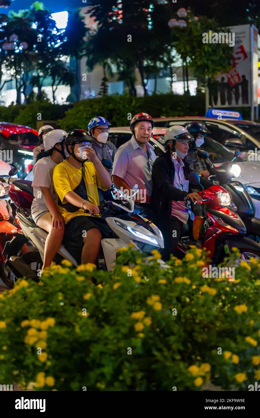 Saigon Street Life. A rush hour motorcycle swarm a dusk in Ho Chi Minh ...