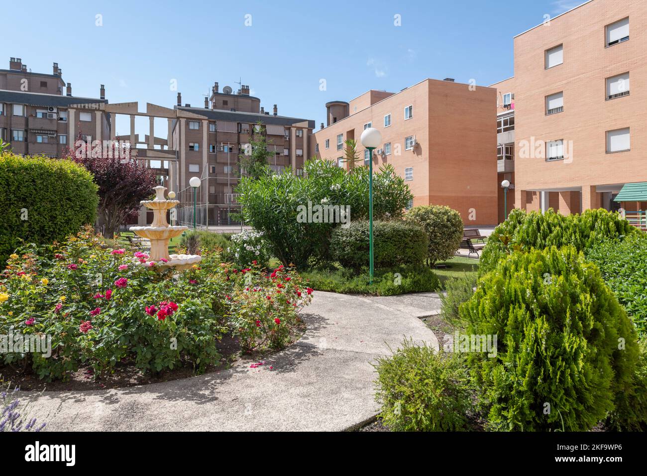 Views of buildings and common areas landscaped with flowers of an urban ...