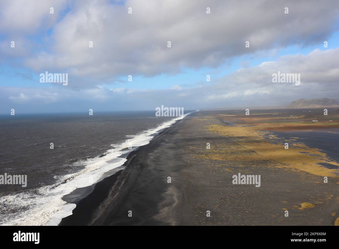 Iceland endless black beach Stock Photo - Alamy