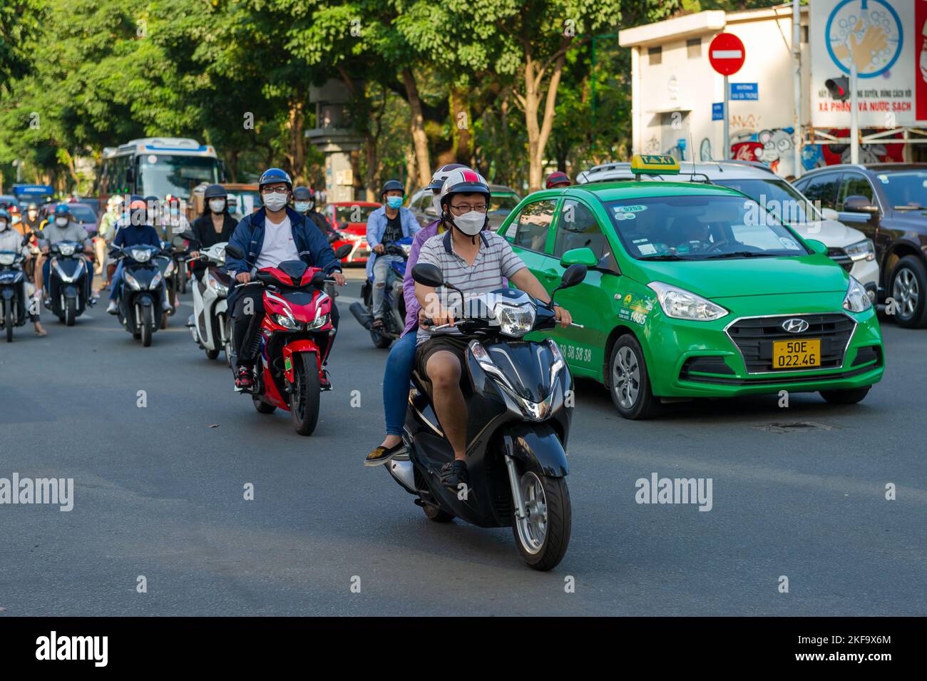Saigon Street Life. A rush hour motorcycle swarm in Ho Chi Minh City ...