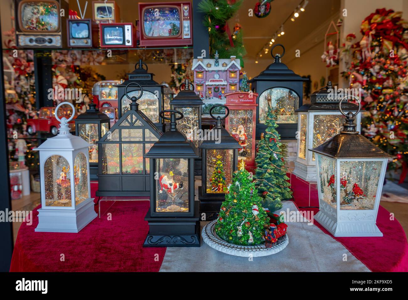 Cute Christmas lanterns, with artificial snow and glitter swirling in ...