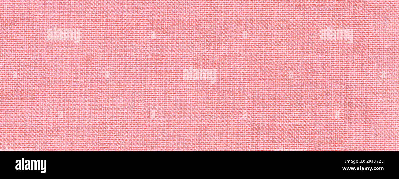 Light pink background from a textile material with wicker pattern ...