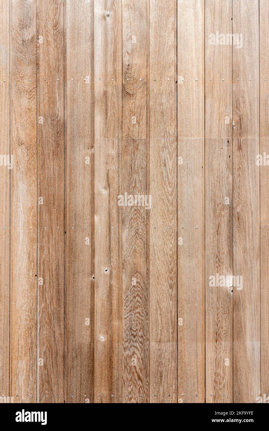 New modern brown wooden fence panel background with rough knotted grain ...