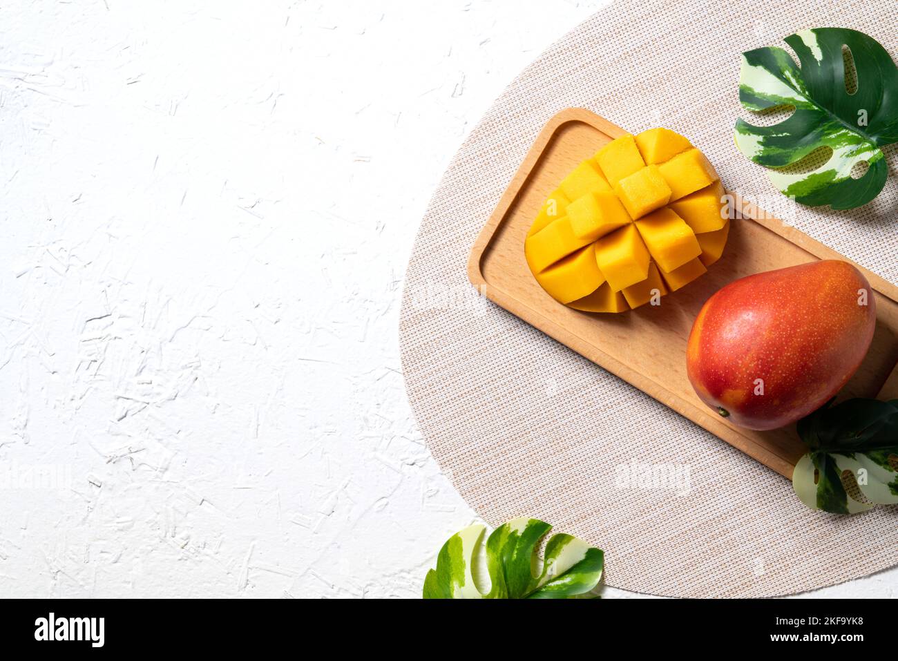 Mango background design concept. Top view of diced fresh mango fruit ...