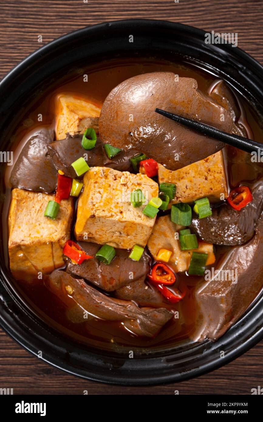 Delicious spicy duck blood jelly soup bowl and stinky tofu with ...