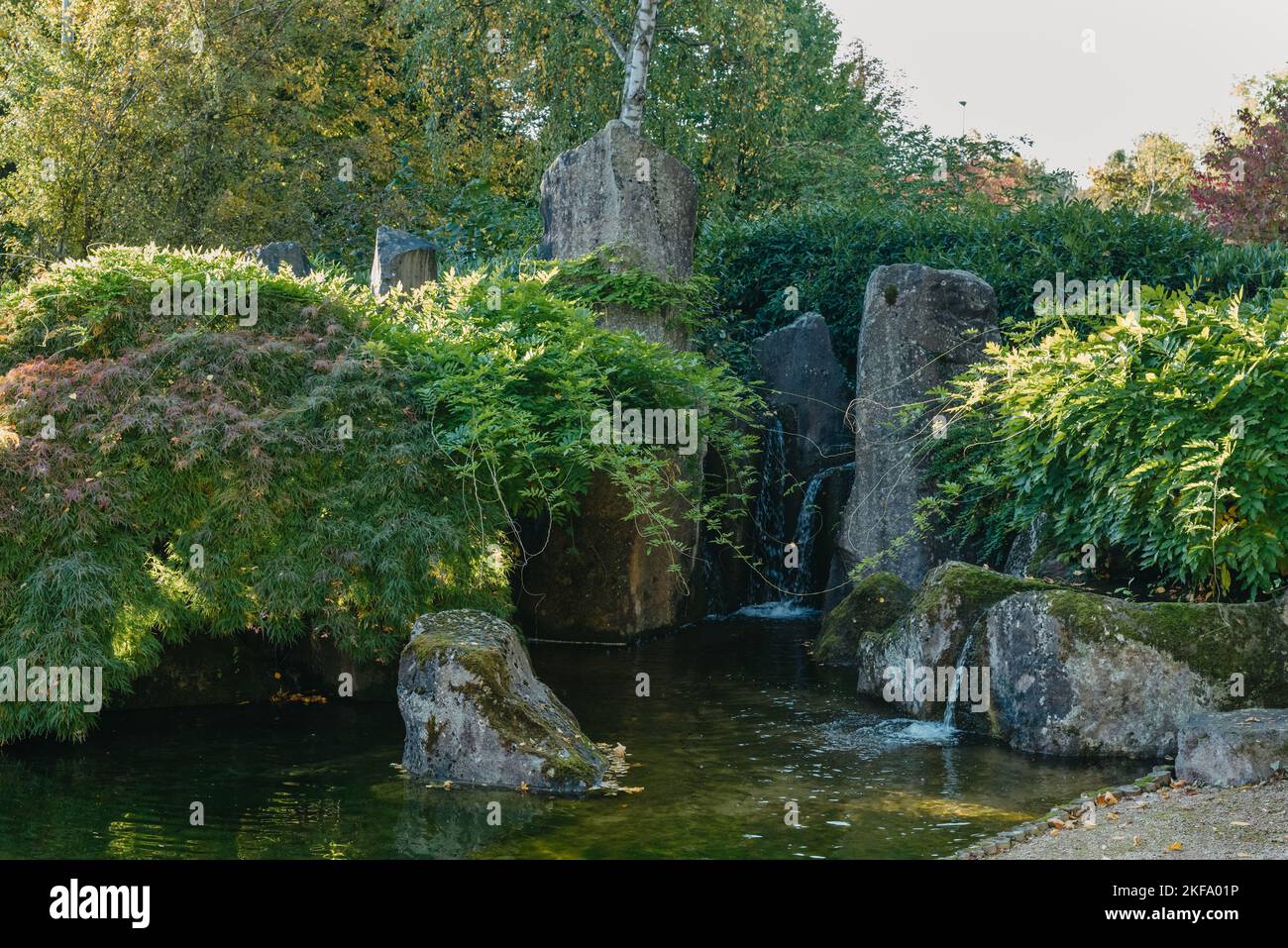 Beautiful calm scene with waterfall in spring Japanese garden. Japan ...