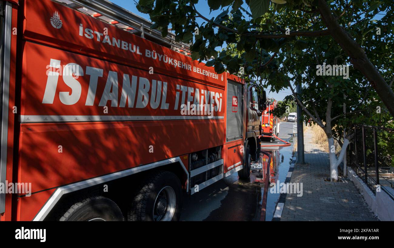 Firefighters are responding to the field fire with fire trucks in ...