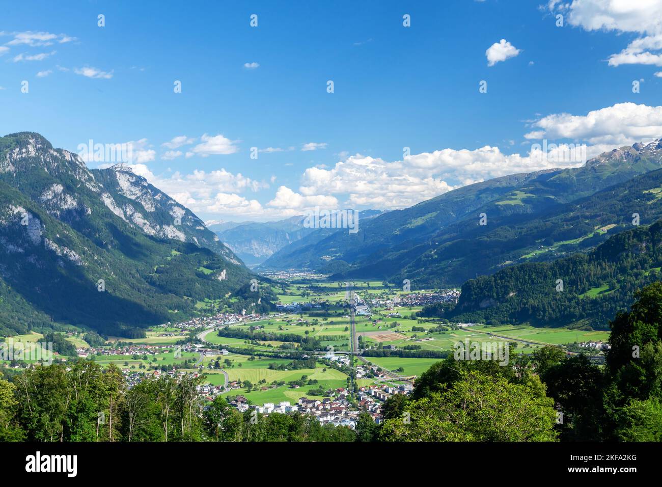 Panoramic view of countryside, green alpine meadows and the Alps ...
