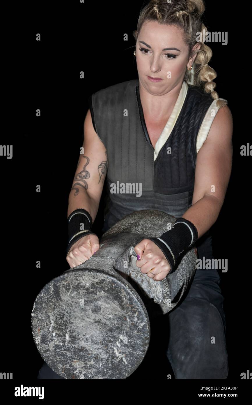 Basque stone that elevates the concept of rural sport. woman from the ...