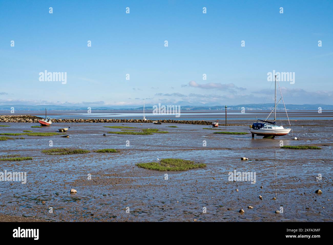 Boat in mud at low tide, Morecambe Bay, Lancashire Stock Photo - Alamy