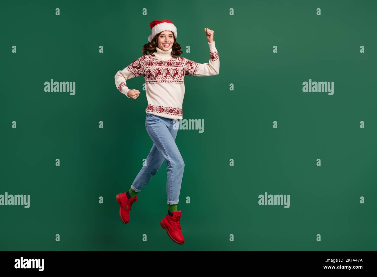Full body photo of excited pretty lady jumping running raise fists ...