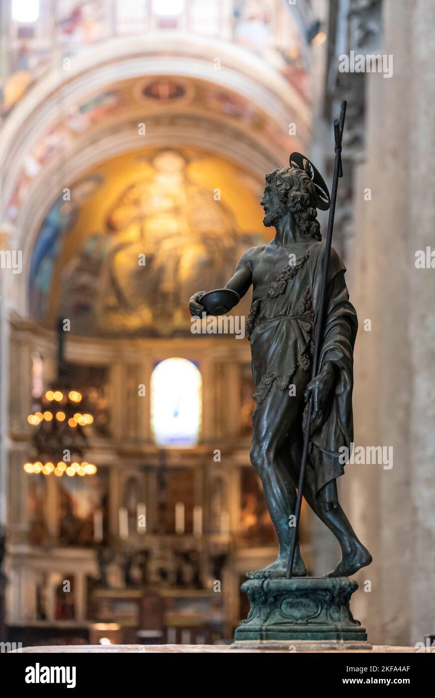 Metal mini statue of catholic saint inside basilica in Pisa Stock Photo ...