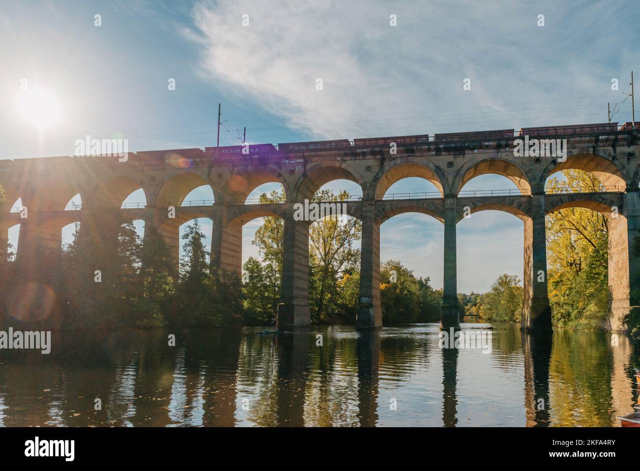 Germany train passing train bridge on cloudy day in germany hi-res ...