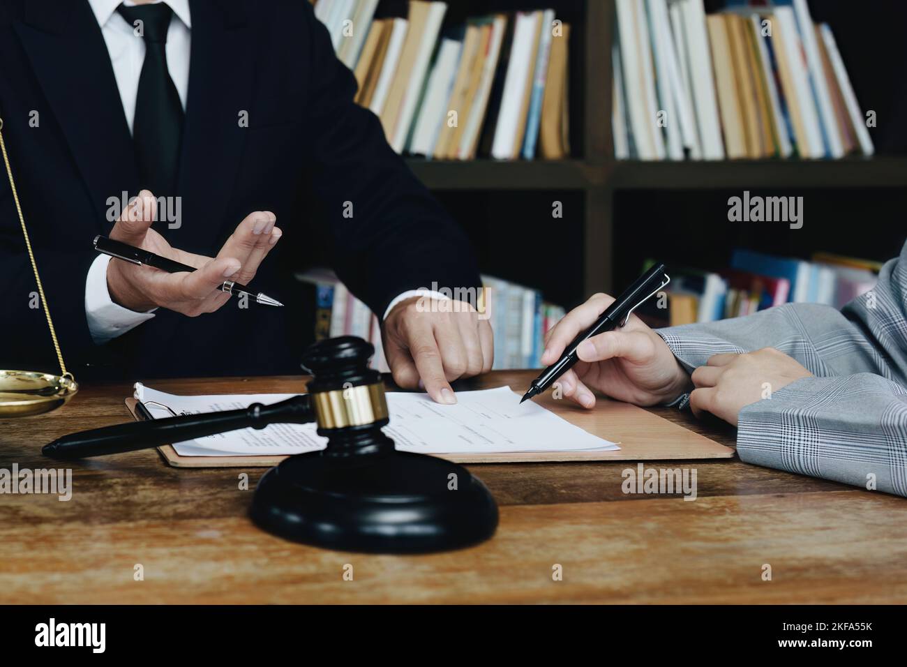 Discussing legal matters and signing important documents Stock Photo ...