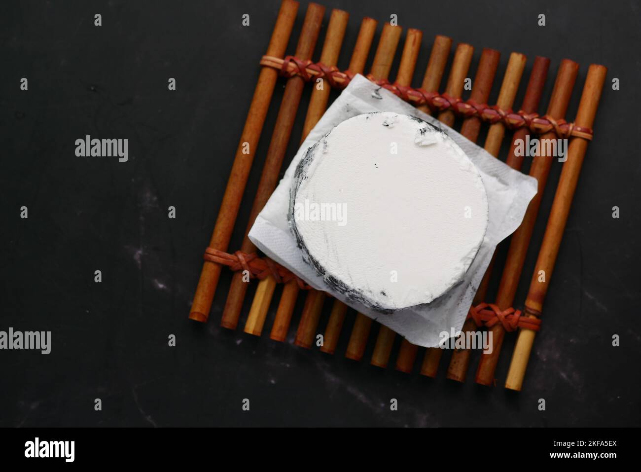 fresh goat cheese and grape fruit on wooden background Stock Photo - Alamy