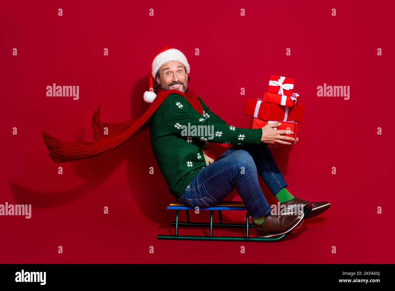 Full length profile photo of overjoyed cheerful man sit ride sledge ...