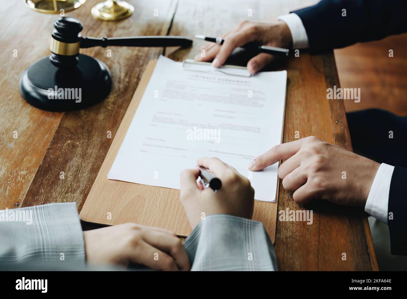 Discussing legal matters and signing important documents Stock Photo ...