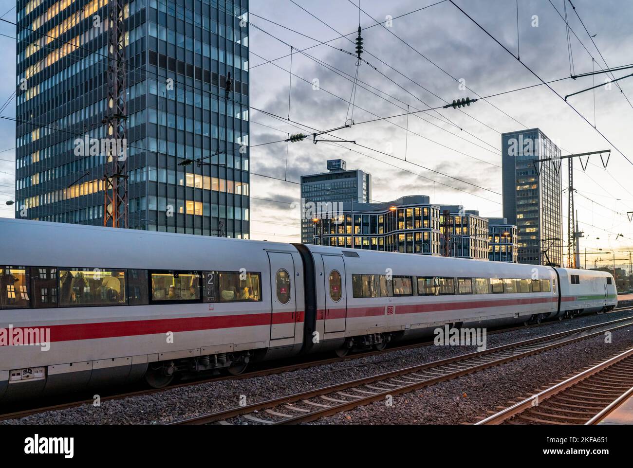 Railway station, ICE train on platform, skyline of Essen city centre ...