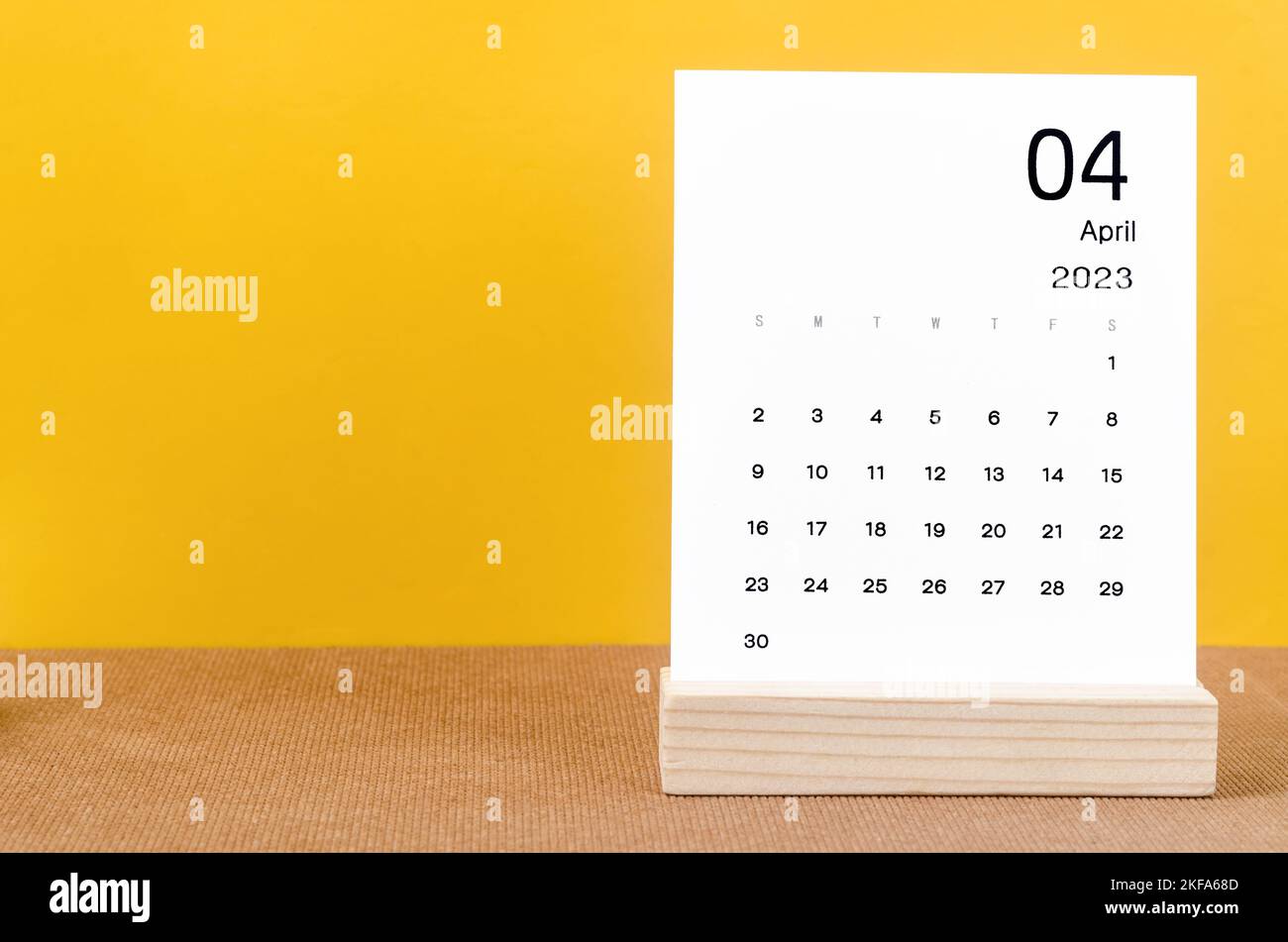 April 2023 Monthly calendar for 2023 year on yellow table Stock Photo ...