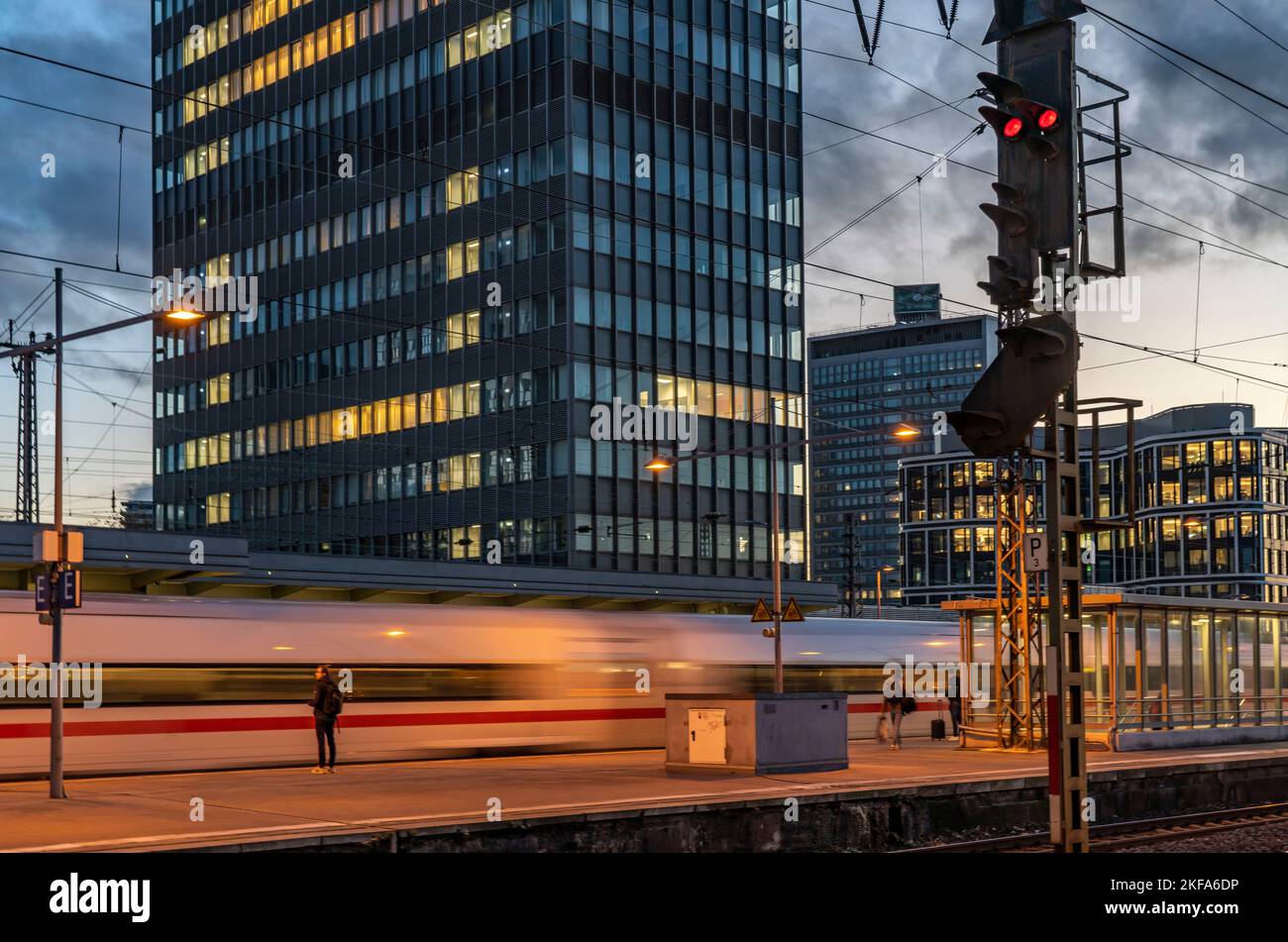 Railway station, ICE train on platform, skyline of Essen city centre ...