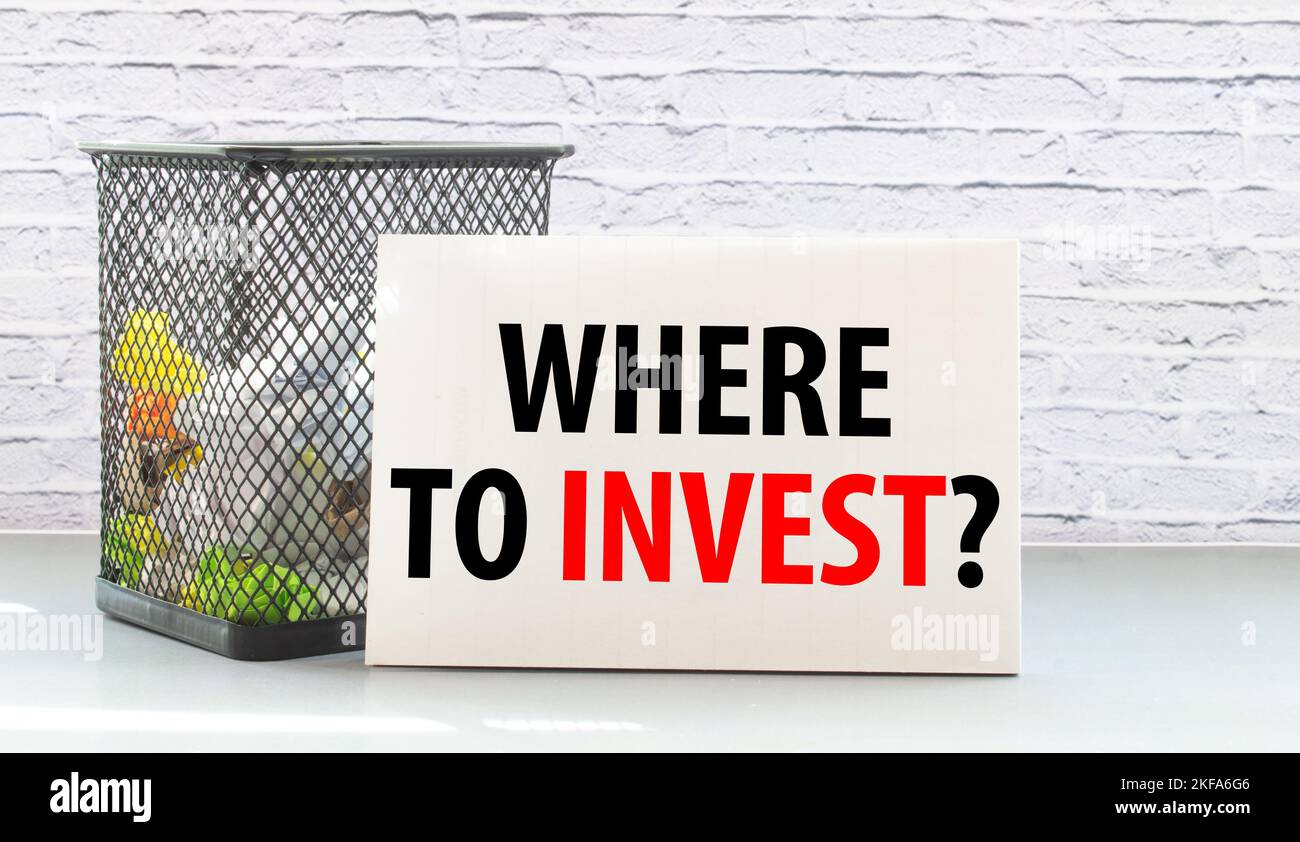 Hand writing the text: Where to Invest Stock Photo - Alamy