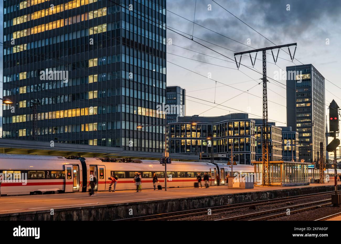 Railway station, ICE train on platform, skyline of Essen city centre ...