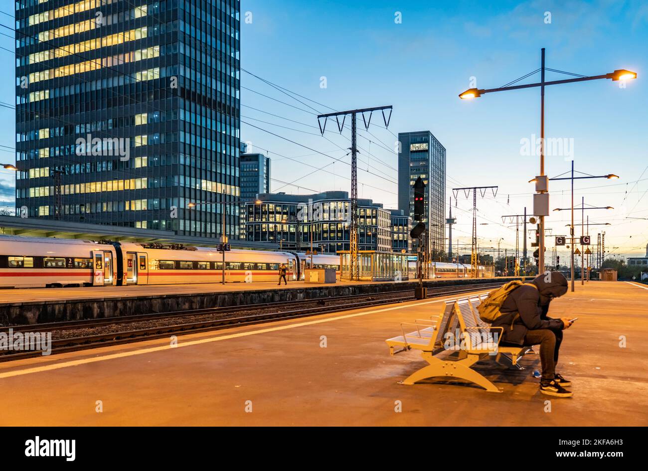 Railway station, ICE train on platform, skyline of Essen city centre ...