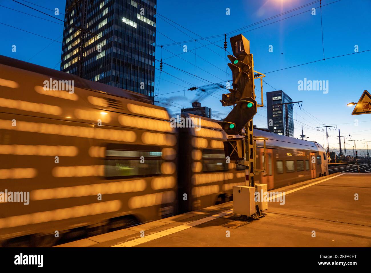 Train station, RRX regional express train on the platform, skyline of ...