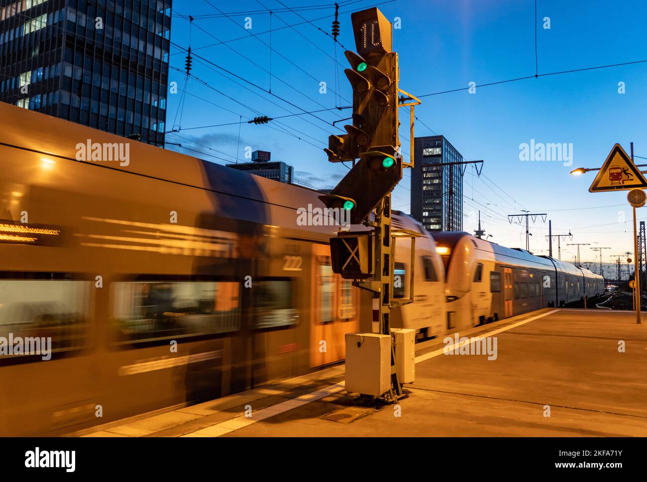 Train station, RRX regional express train on the platform, skyline of ...