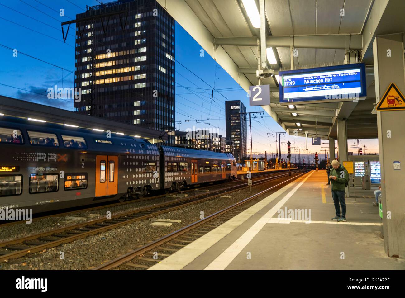 Train station, RRX regional express train on the platform, skyline of ...