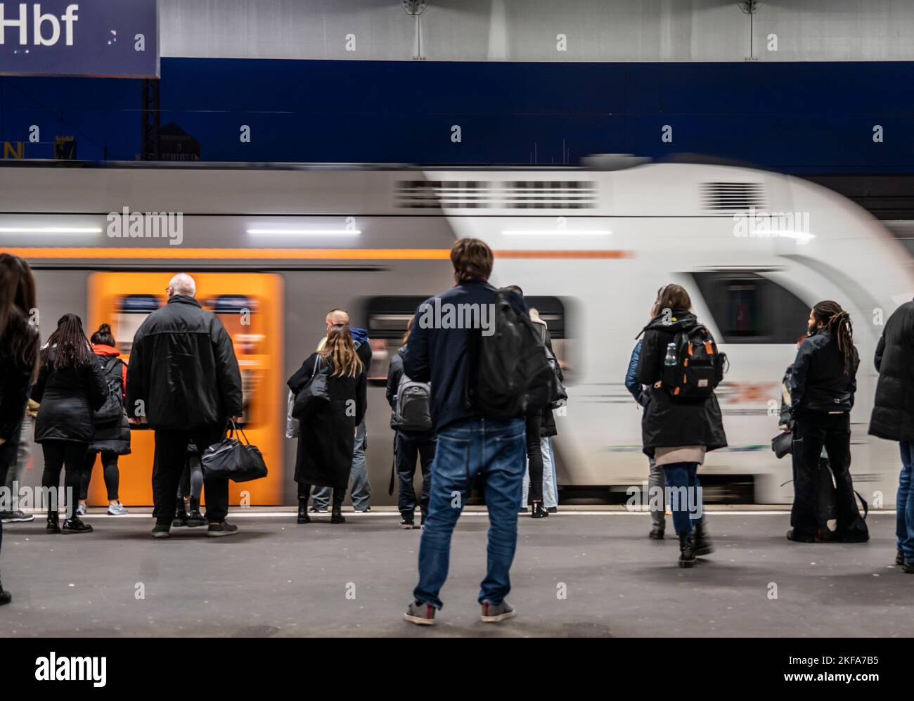 Train station, RRX regional express train on platform, passengers ...